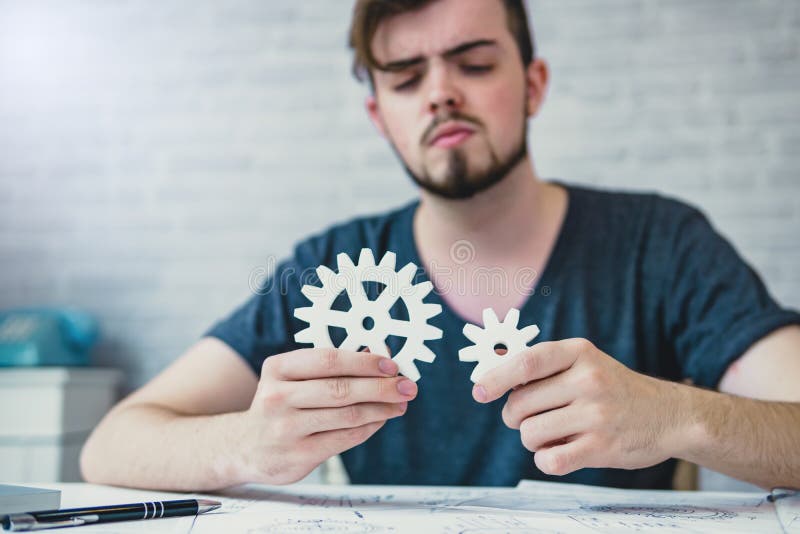 Engineering Man Working on Blueprint for Designing Mechanical Pa Stock ...