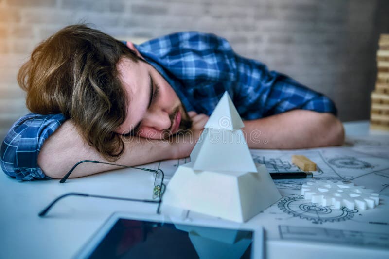 Engineering Man Working Overwork and Sleep on the Desk with Blueprint ...