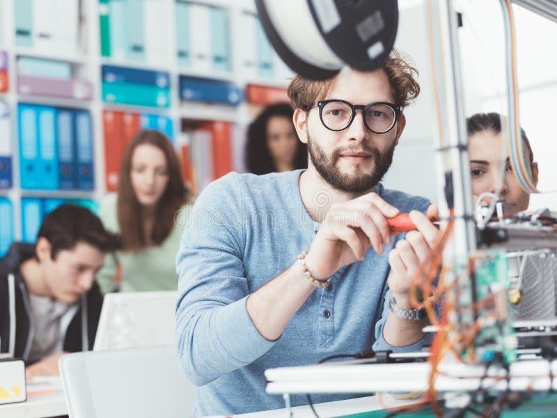 Group of Students Using a 3D Printer and a Laptop Stock Photo - Image ...