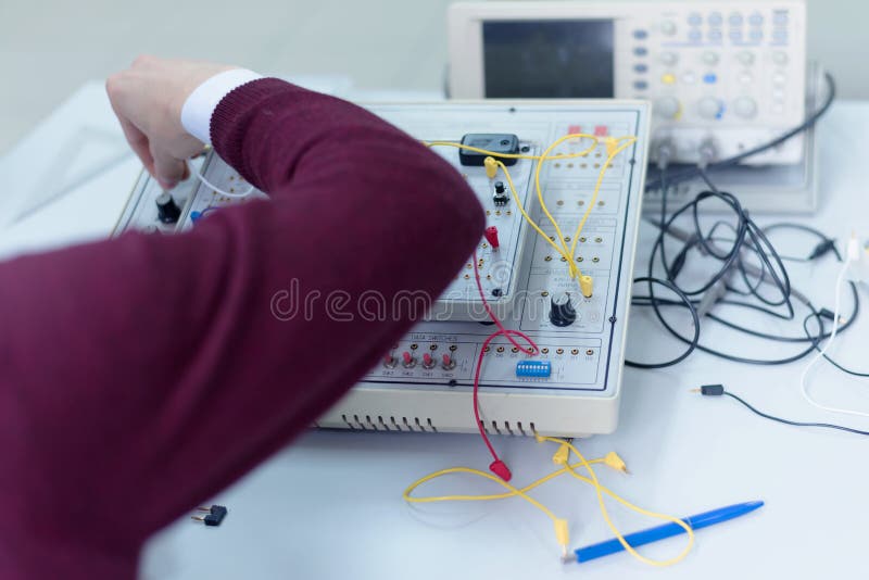 Engineering Students Working in the Lab. Students are Adjusting an ...