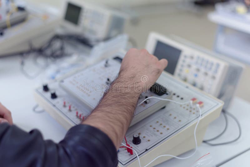 Engineering Students Working in the Lab. Students are Adjusting an ...