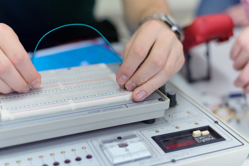 Engineering Students Working in the Lab. Students are Adjusting an ...
