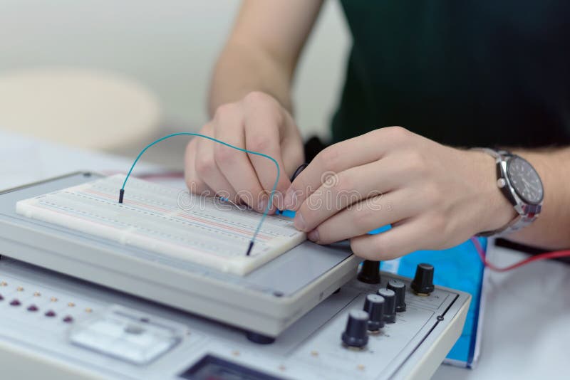 Engineering Students Working in the Lab. Students are Adjusting an ...