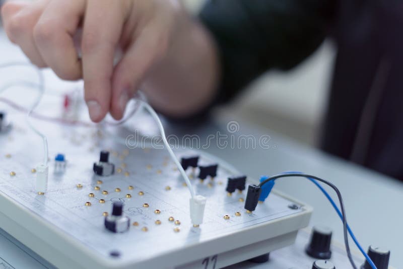 Engineering Students Working in the Lab. Students are Adjusting an ...