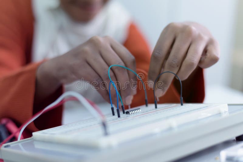 Engineering Students Working in the Lab. Students are Adjusting an ...