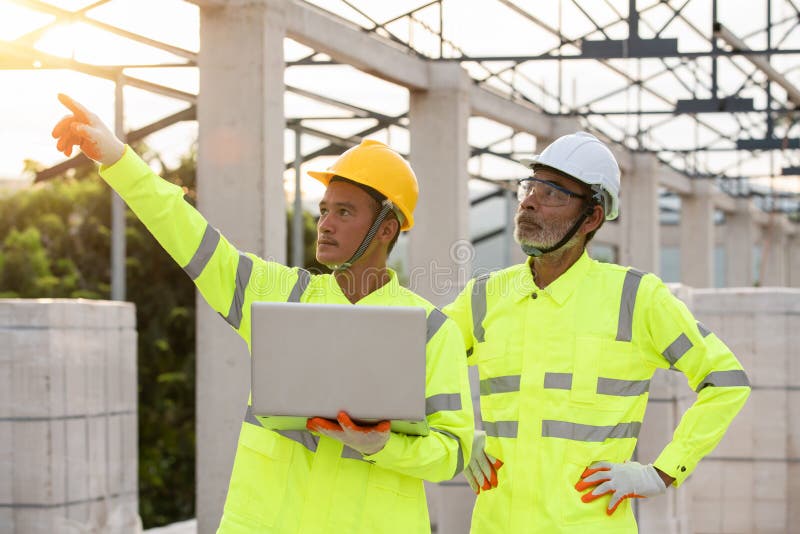 Supervisors and Engineering Use Laptop at the Construction Site Stock ...