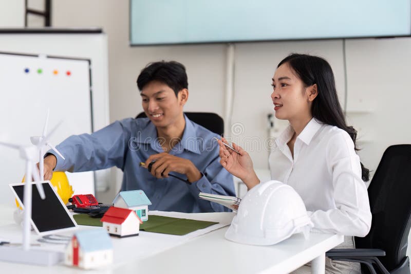 Engineering and Sustainability. Two Engineers Collaborating on an Eco ...