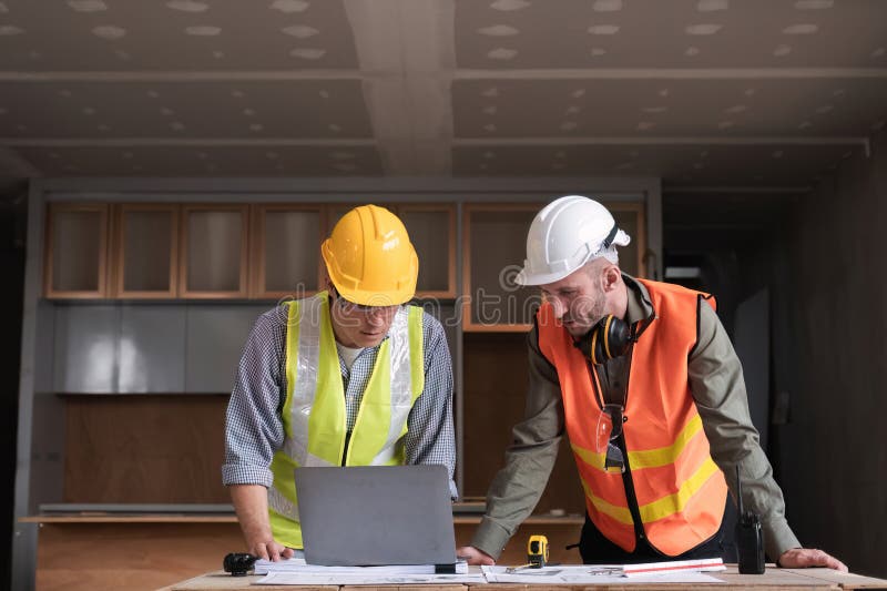 Engineering Team Collaborates on Work Plan at Construction Site with ...