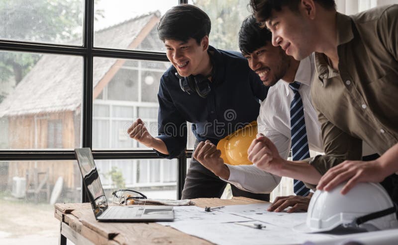 Engineering Team Celebrating Success Together in Modern Office ...