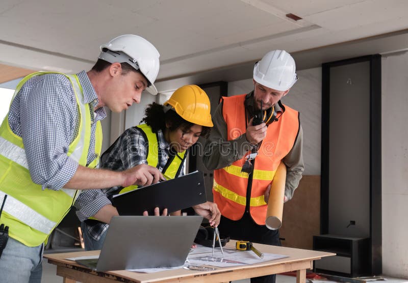 Engineering Team Collaborates on Work Plan at Construction Site with ...