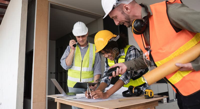Engineering Team Collaborates on Work Plan at Construction Site with ...