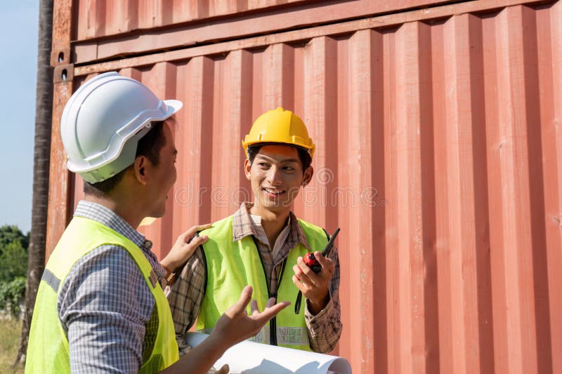 Engineering Teamwork. Engineers Engaging in Logistics Discussions at a ...