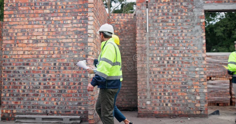 Engineering, Teamwork and People at Construction Site with Floor Plan ...