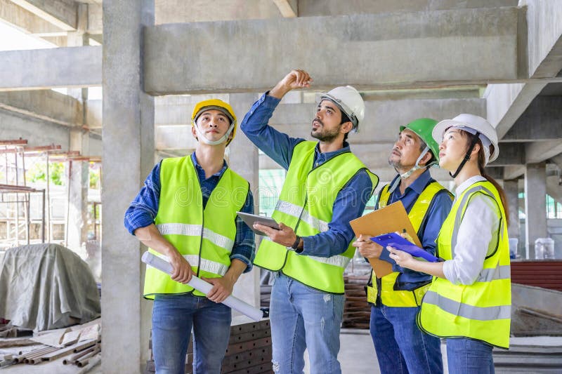Civil Engineers Team Working in the Building Under Construction Site ...