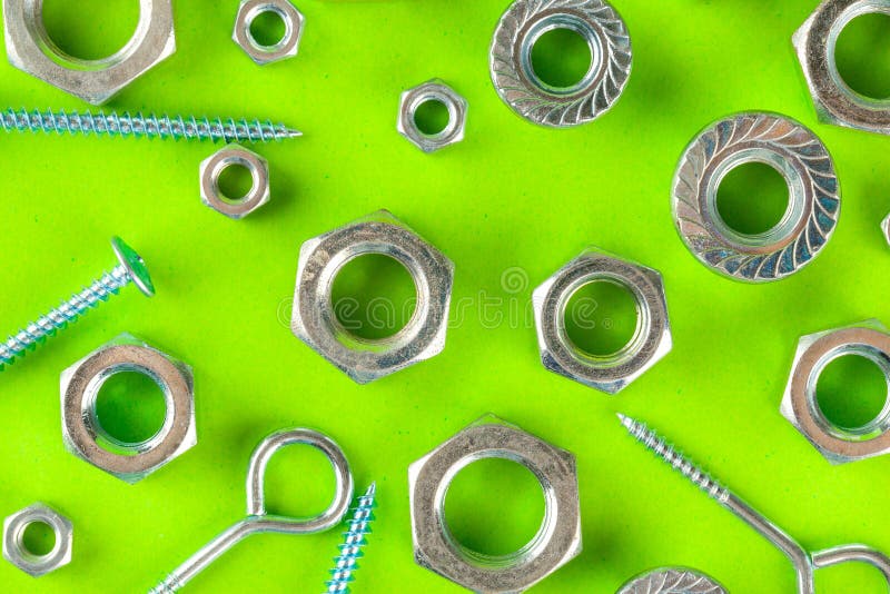 Engineering Tools. Bolts and Nuts on Green Background Stock Image ...