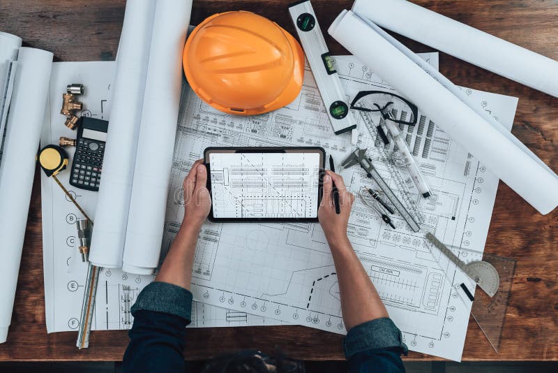 Engineering Working with Drawings Inspection on Laptop in the Office ...