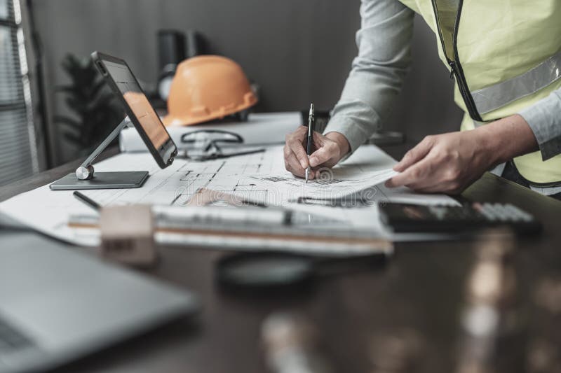 Engineering Working with Drawings Inspection and Writing on Blueprint ...