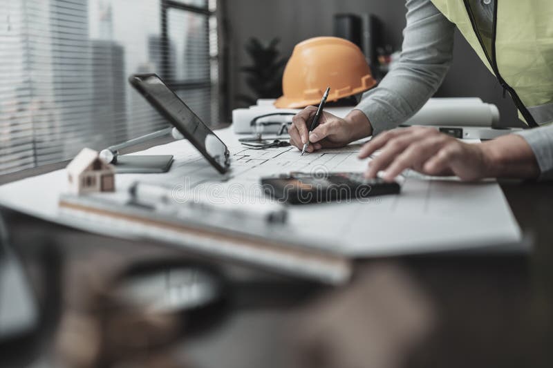 Engineering Working with Drawings Inspection and Writing on Blueprint ...