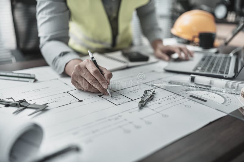 Engineering Working with Drawings Inspection and Writing on Blueprint ...