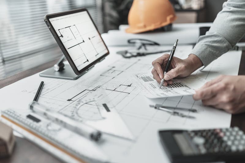 Engineering Working with Drawings Inspection and Writing on Blueprint ...