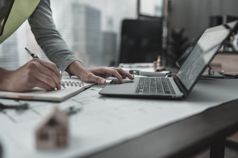 Engineering Working with Laptop Inspection on the Office Desk. Engineer ...