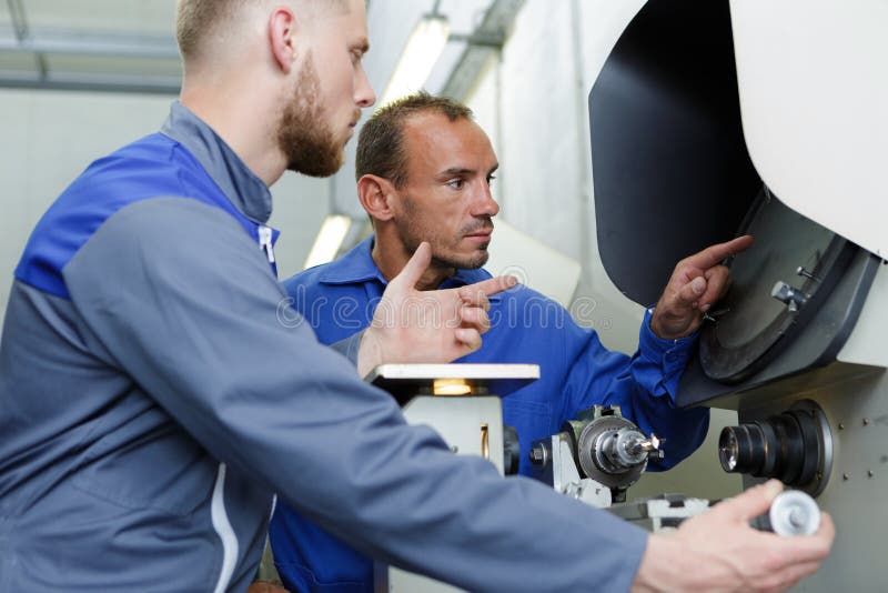 Man adjusting machinery stock photo. Image of vocation - 179189852