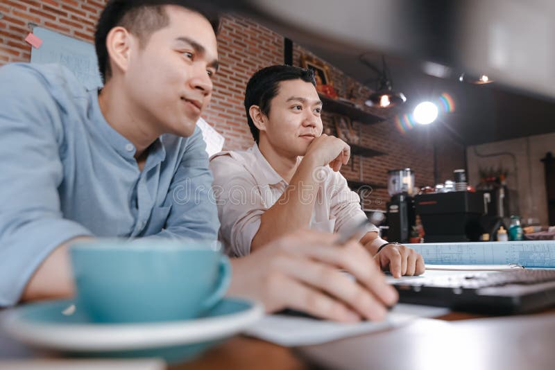 Engineers and Architect Reading Building and Drawing Outlay ...