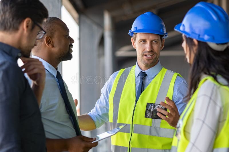 Engineers and Architects in Conversation at Building Site Stock Image ...