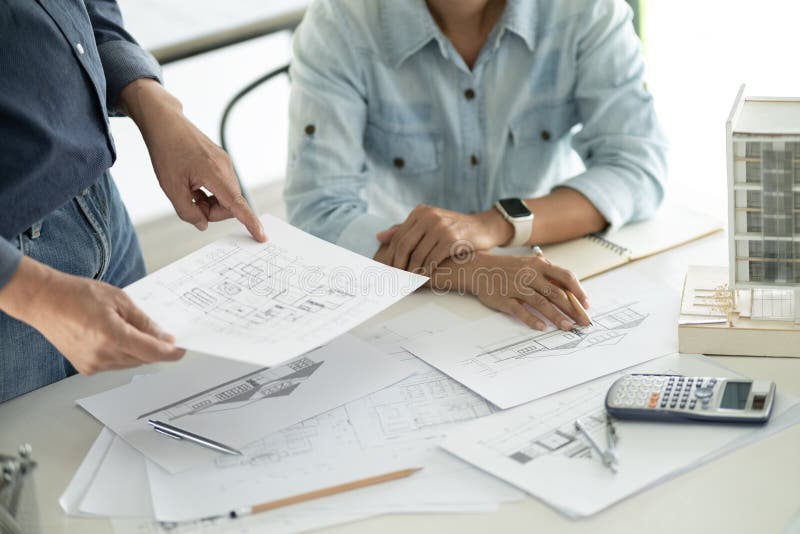 Engineers and Architects are Looking at the Plans of the Construction ...