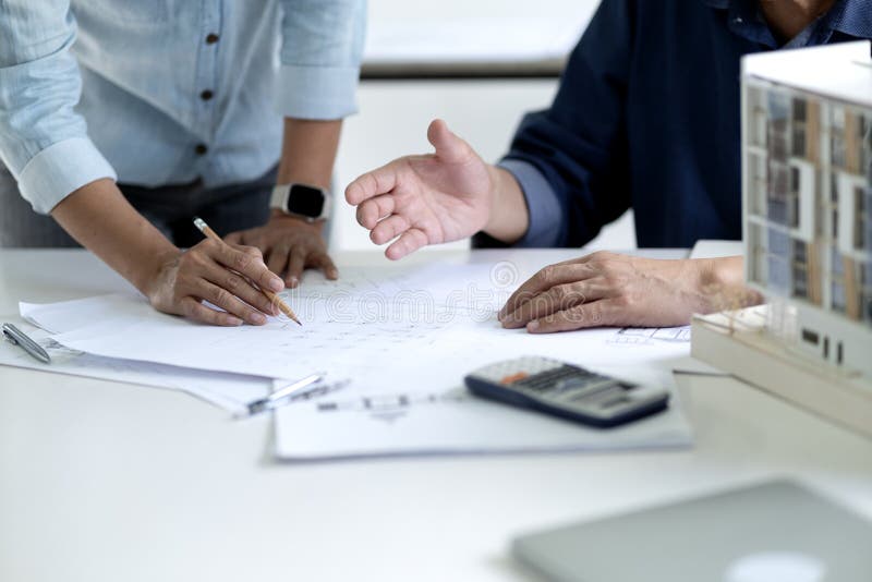 Engineers and Architects are Looking at the Plans of the Construction ...