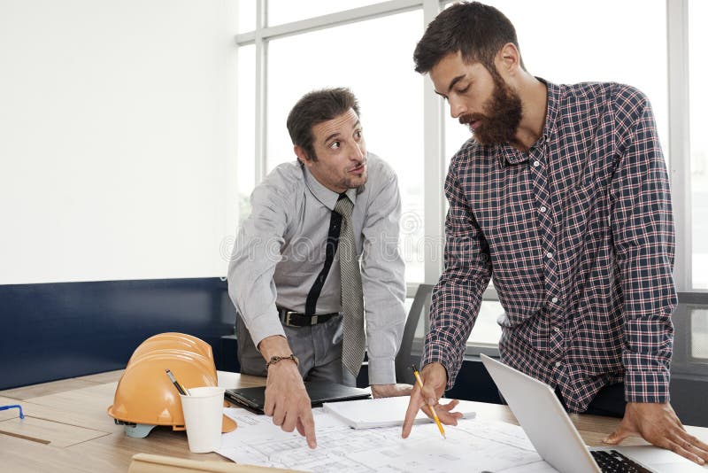Civil Engineers Pointing at a House Stock Image - Image of female ...