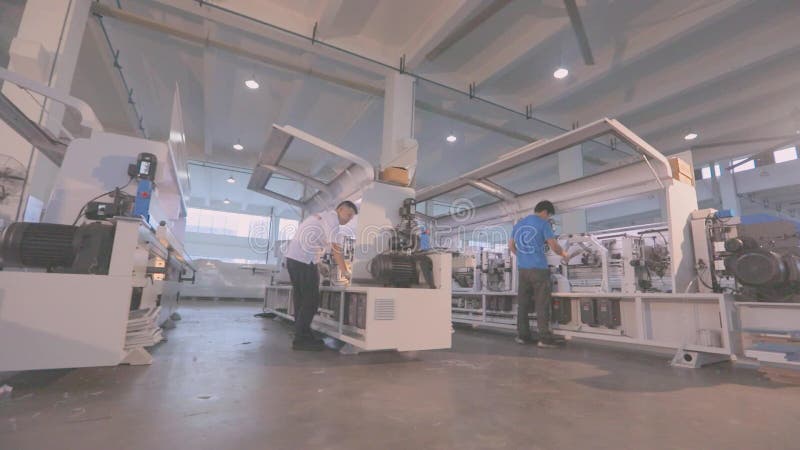 Engineers Assemble Machines at a Large Modern Plant, the Process of ...