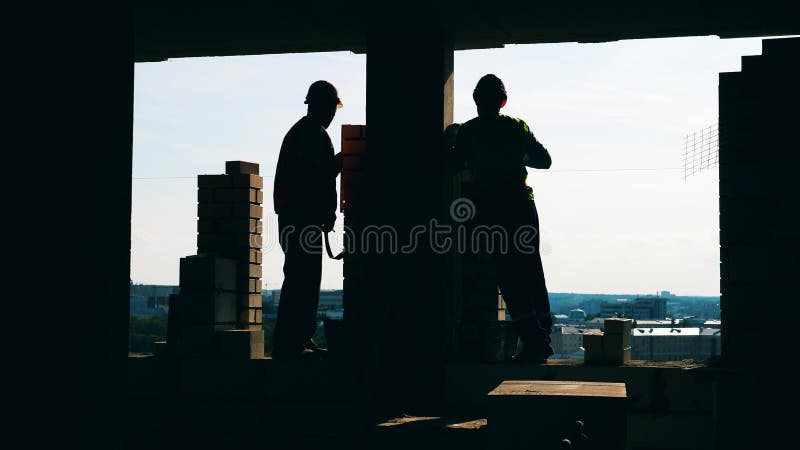 Engineers Check Brick Wall on a Building Site. Stock Footage - Video of ...