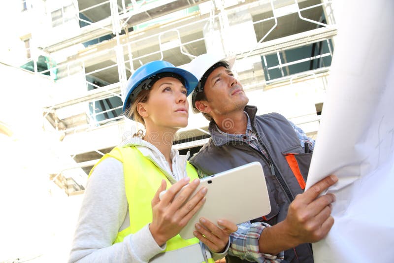 Engineers Checking Plan on Construction Site Stock Photo - Image of ...