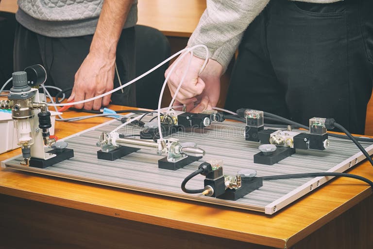 Engineers Connect Wires Control Panel with Small Test Bench for ...