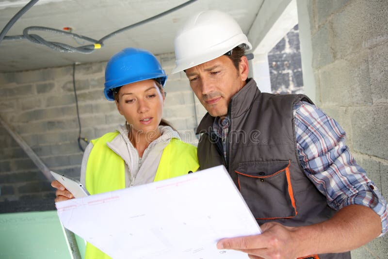 Engineers on Construction Site Verifying Installations Stock Photo ...