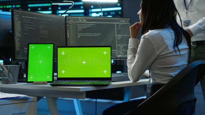 Engineers In Data Center Monitoring Security Threats Using Chroma Key Devices Stock Image