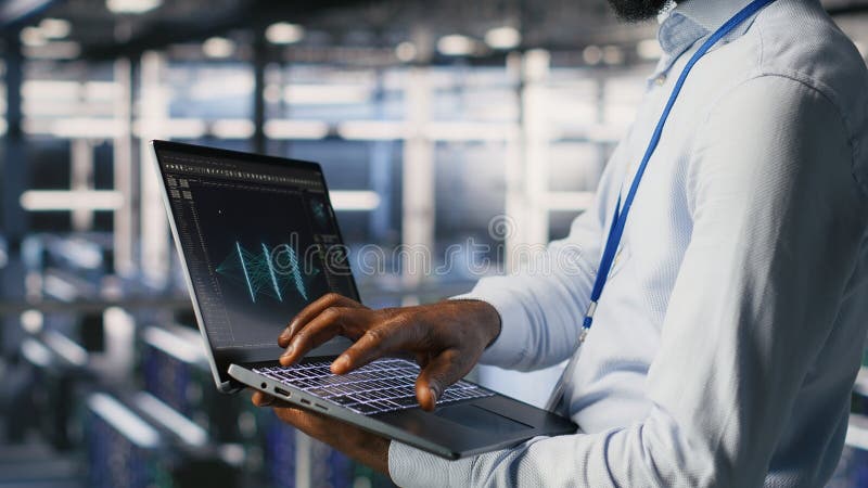 Engineers in Data Center Reviewing Large Language Model Visualizations on Laptop Stock Photo ...