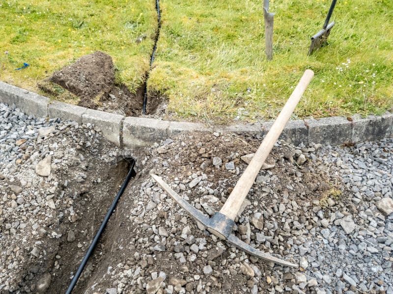Engineers Digging a New Fibre Cable into the Ground Stock Photo - Image ...