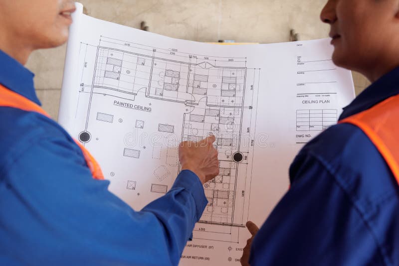 Engineers Discussing Blueprint Stock Photo - Image of planning, worker ...