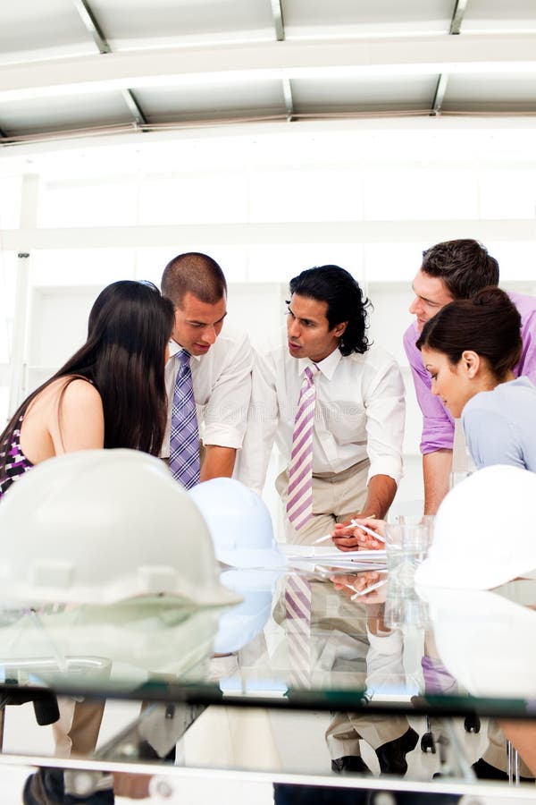Engineers Discussing Blueprints Stock Image - Image of paper, group ...