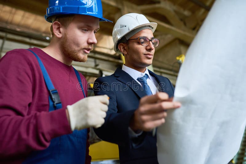 Professional Male Engineers are Talking at Office Stock Photo - Image ...