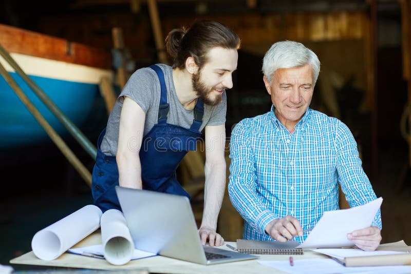 Engineers Discussing Papers Stock Image - Image of planning, artisan ...