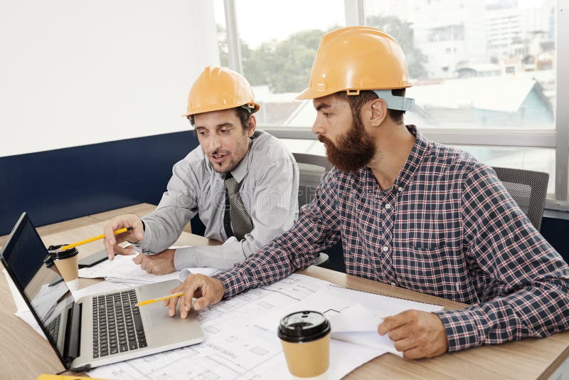 Engineers Discussing Project in Laptop Screen Stock Image - Image of ...