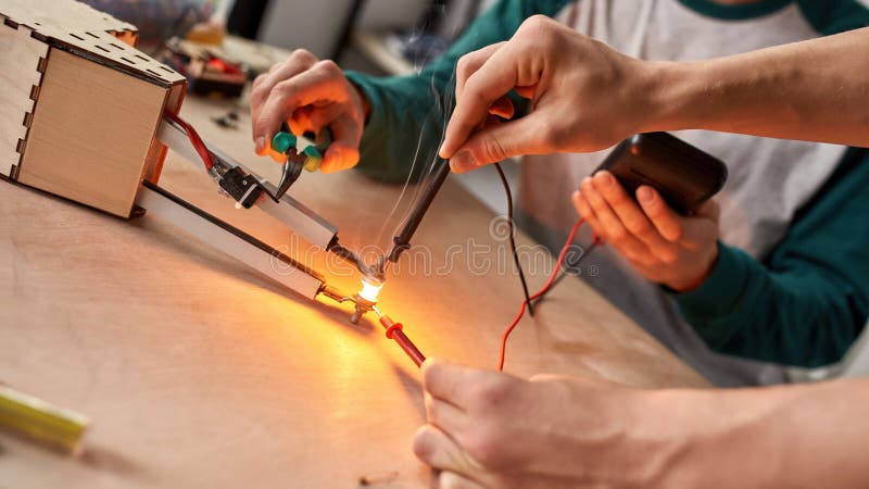 Engineers Do Experiment with Forceps and Voltmeter Stock Image - Image ...