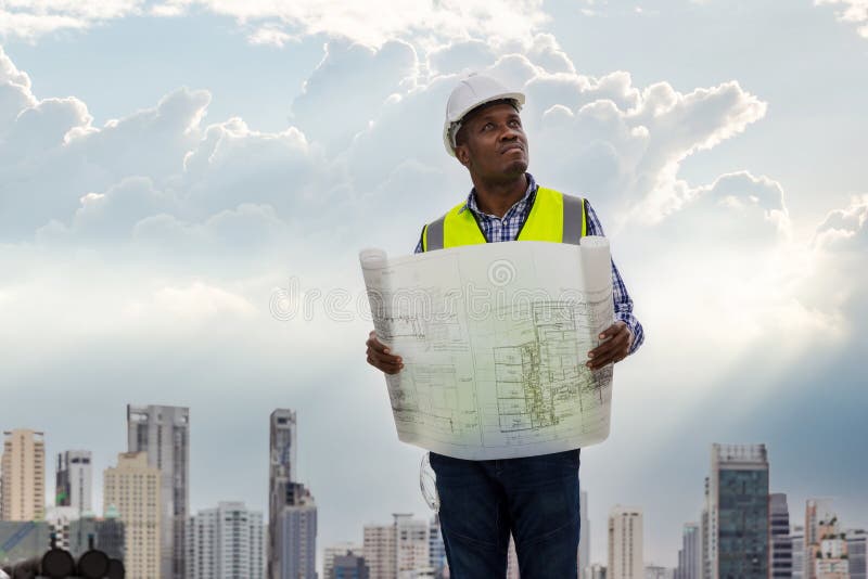 Engineers with Draft Plan of Building on Constructing Site. Engineer ...