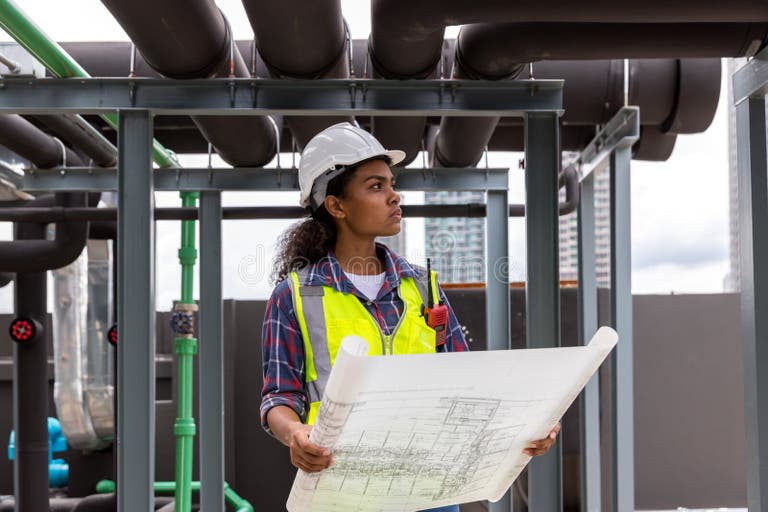 Engineers with Draft Plan of Building on Constructing Site. Engineer ...