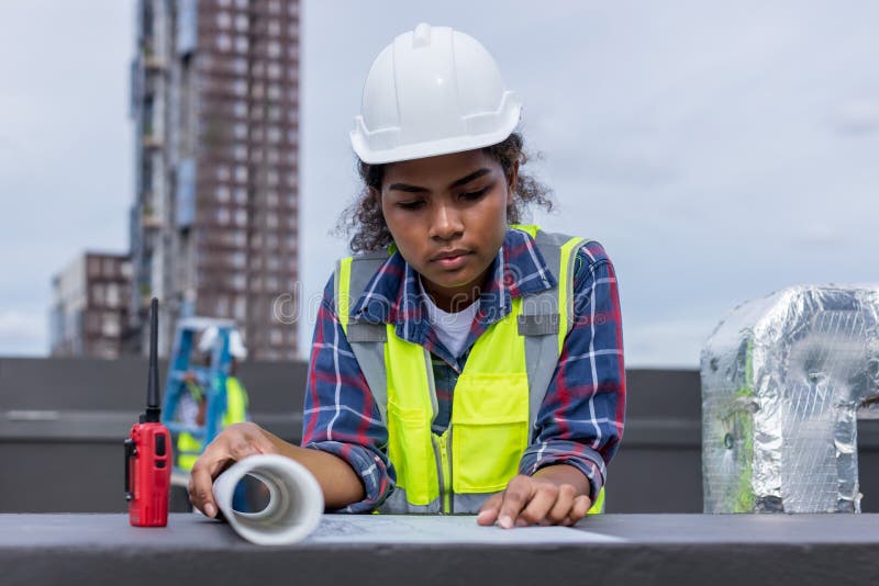 Engineers with Draft Plan of Building on Constructing Site. Engineer ...