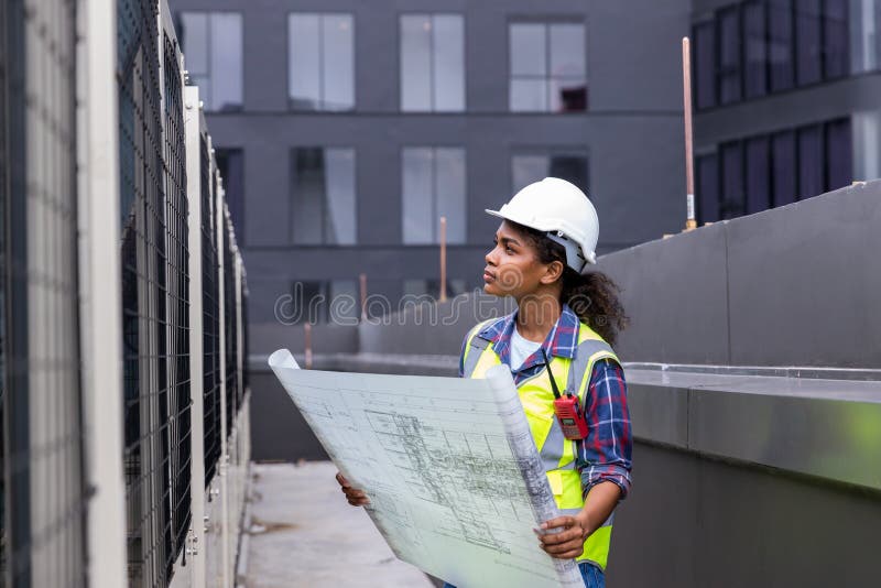 Engineers with Draft Plan of Building on Constructing Site. Engineer ...