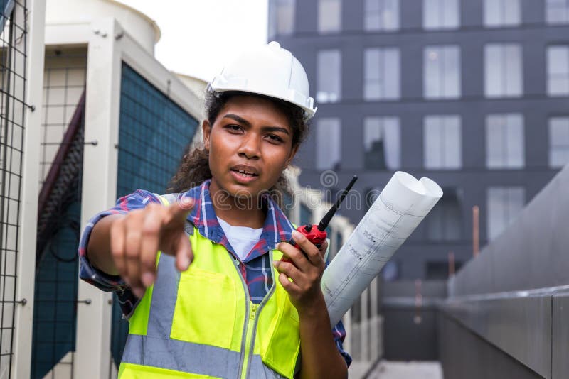 Engineers with Draft Plan of Building on Constructing Site. Engineer ...
